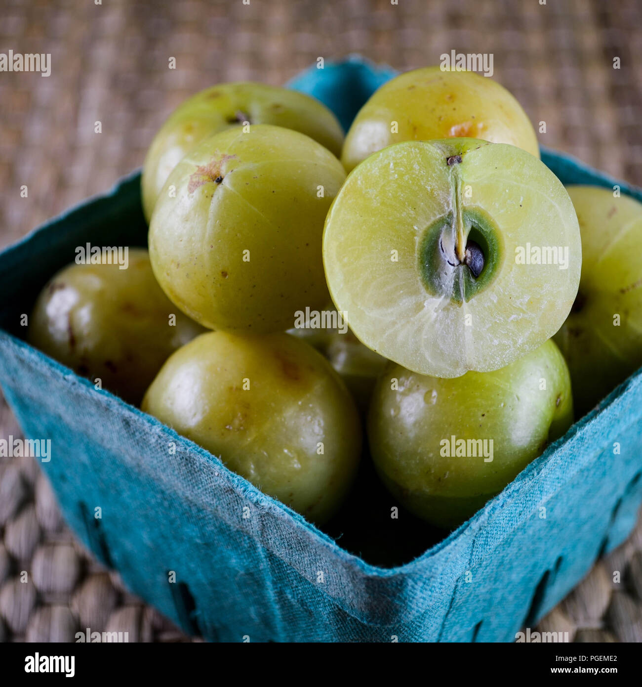 Amla, aka Indian gooseberry (Phyllanthus emblica) in a blue produce ...