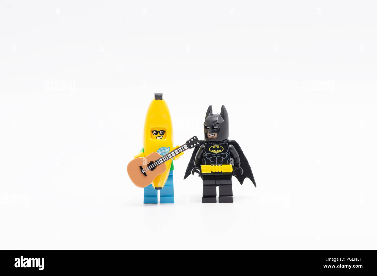 Lego batman and banana suit guy holding a guitar Stock Photo - Alamy