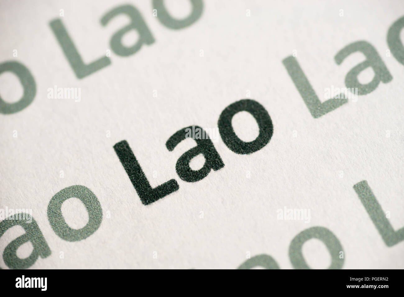 word Lao language printed on white paper macro Stock Photo - Alamy