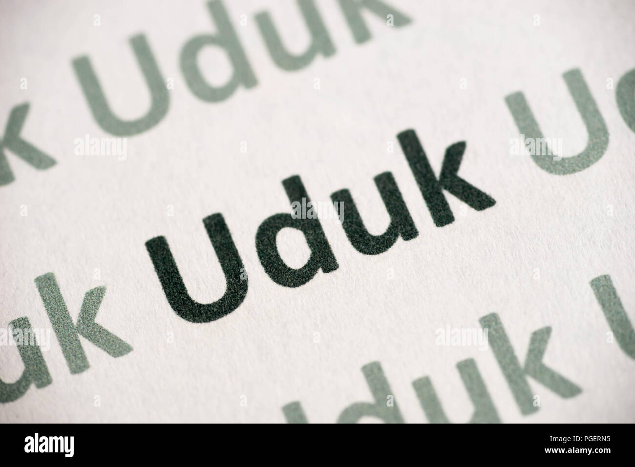 word Uduk language printed on white paper macro Stock Photo - Alamy