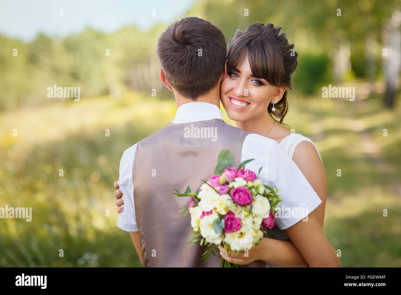 Beautiful wedding couple hugs hi-res stock photography and images - Alamy