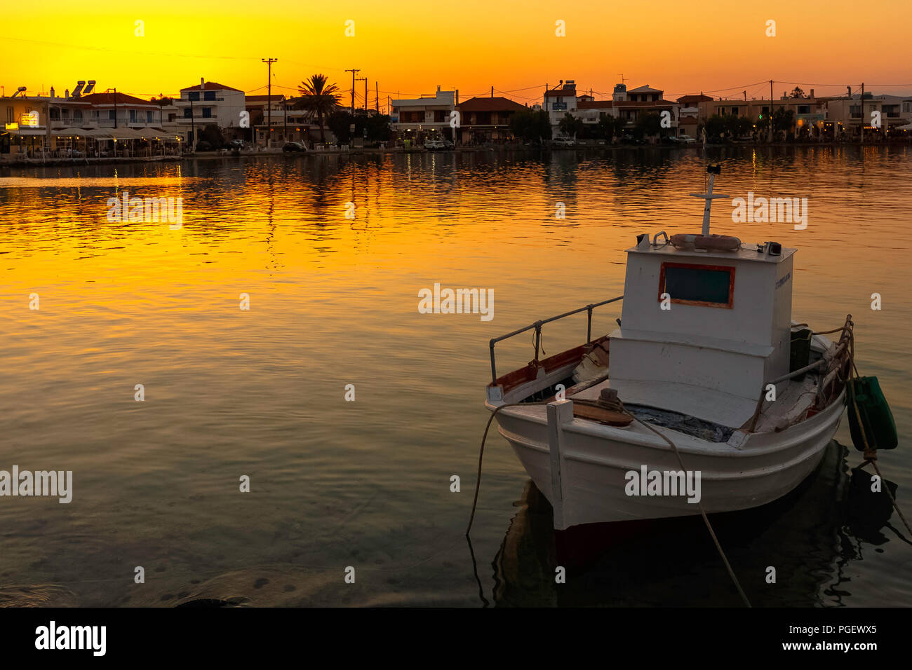 Elafonisos village against the setting sun, a beautiful fish village in ...