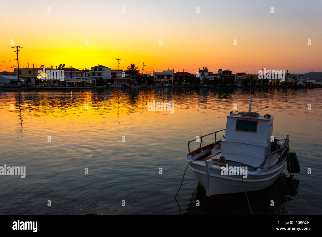 Elafonisos village against the setting sun, a beautiful fish village in ...