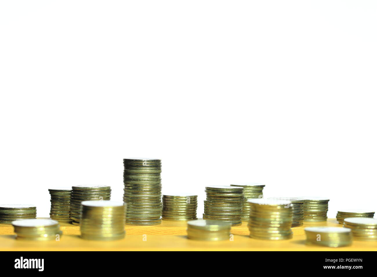 isolated scattered coin towers on white background Stock Photo - Alamy