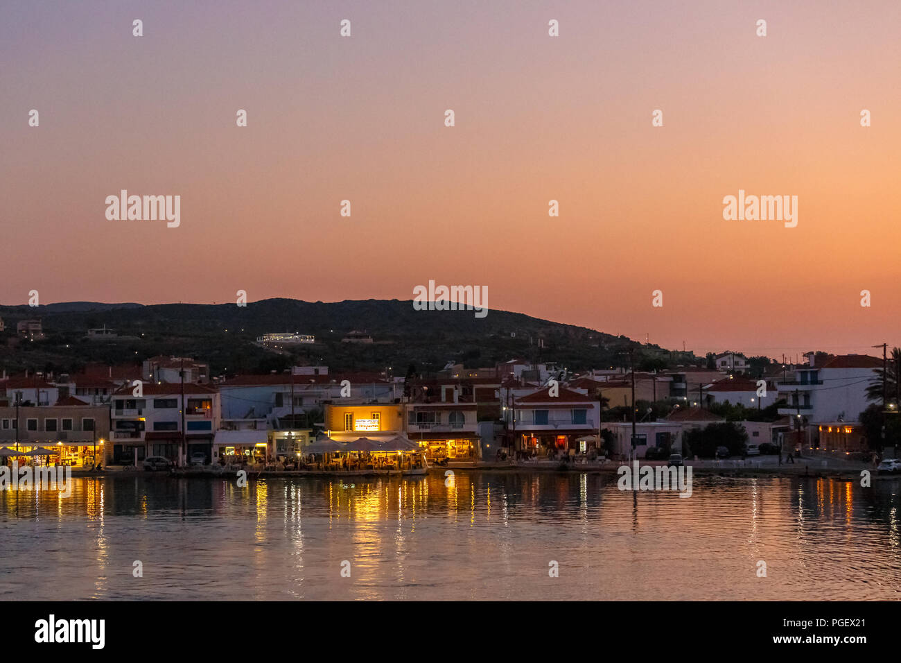 Elafonisos village against the setting sun, a beautiful fish village in ...
