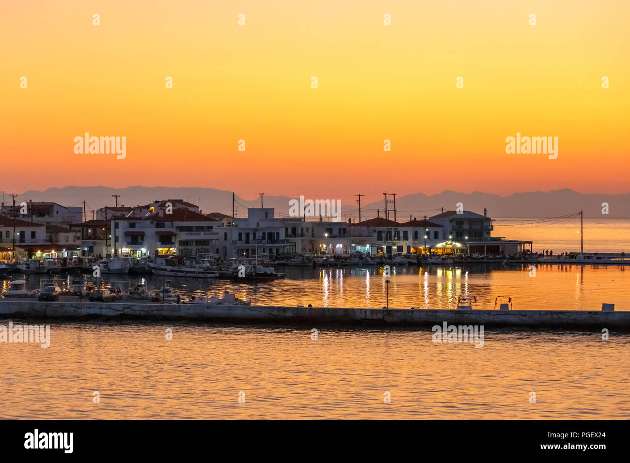 Elafonisos village against the setting sun, a beautiful fish village in ...
