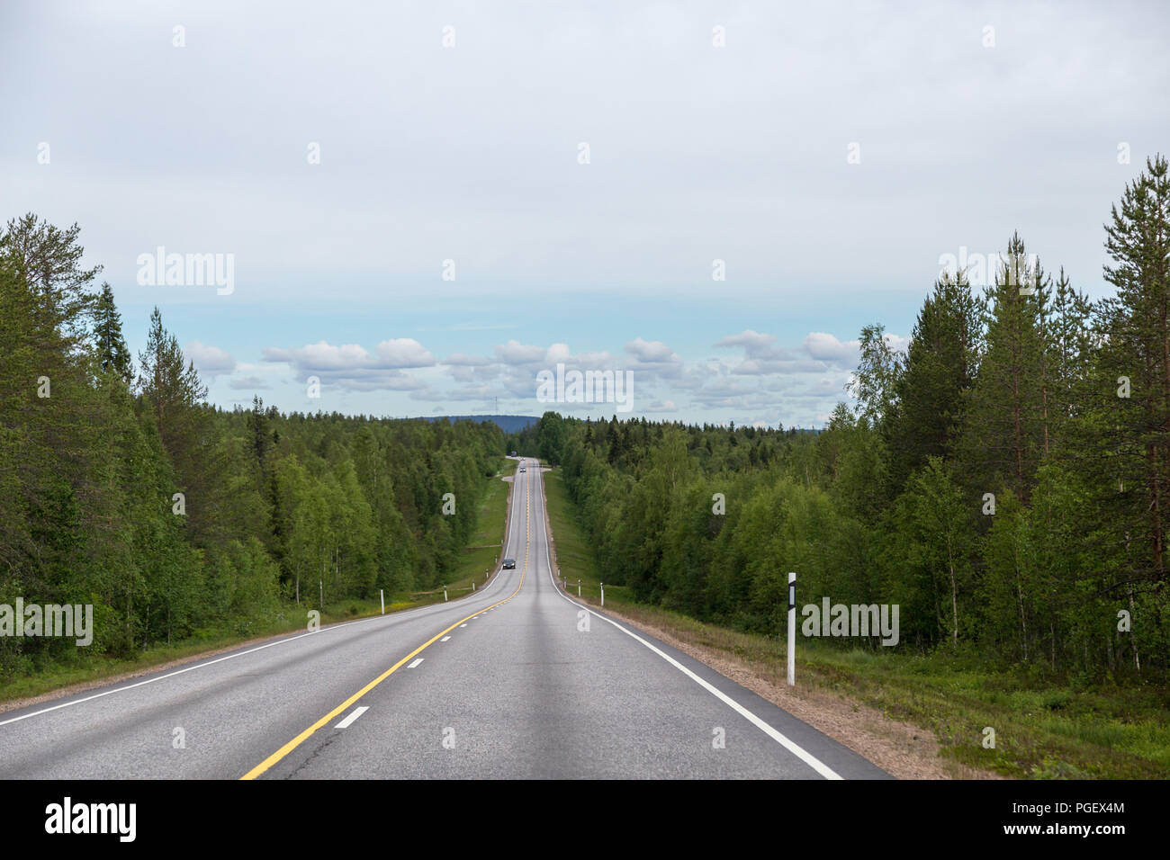 Lapland Finland, road in the north with cars and forest on a summer day ...