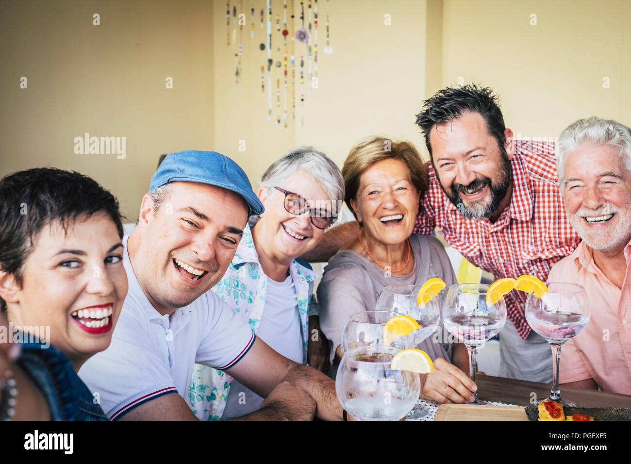 mixed ages group of caucasian people having fun together celebrating an ...