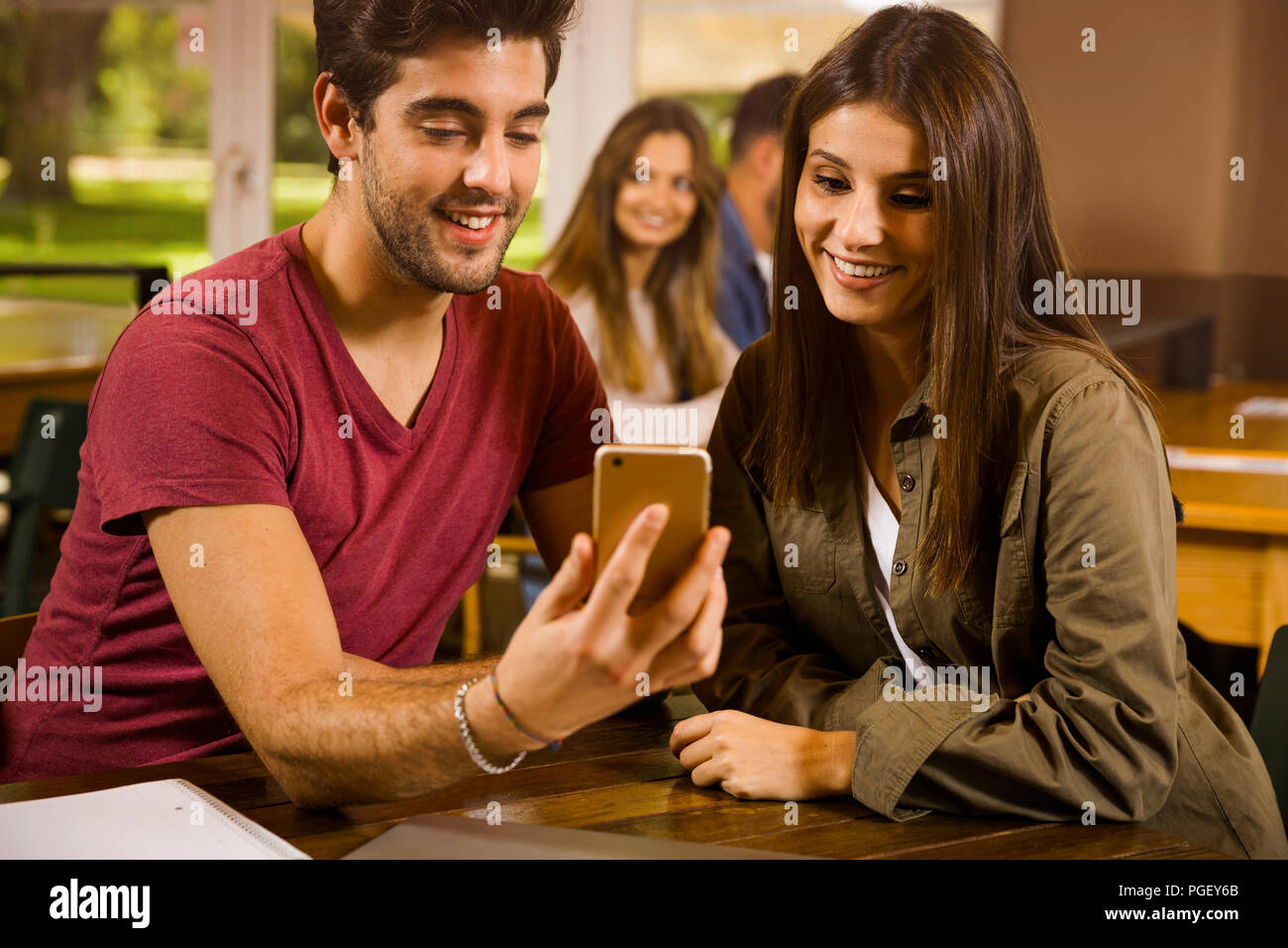 Happy female friends watching sharing hi-res stock photography and ...