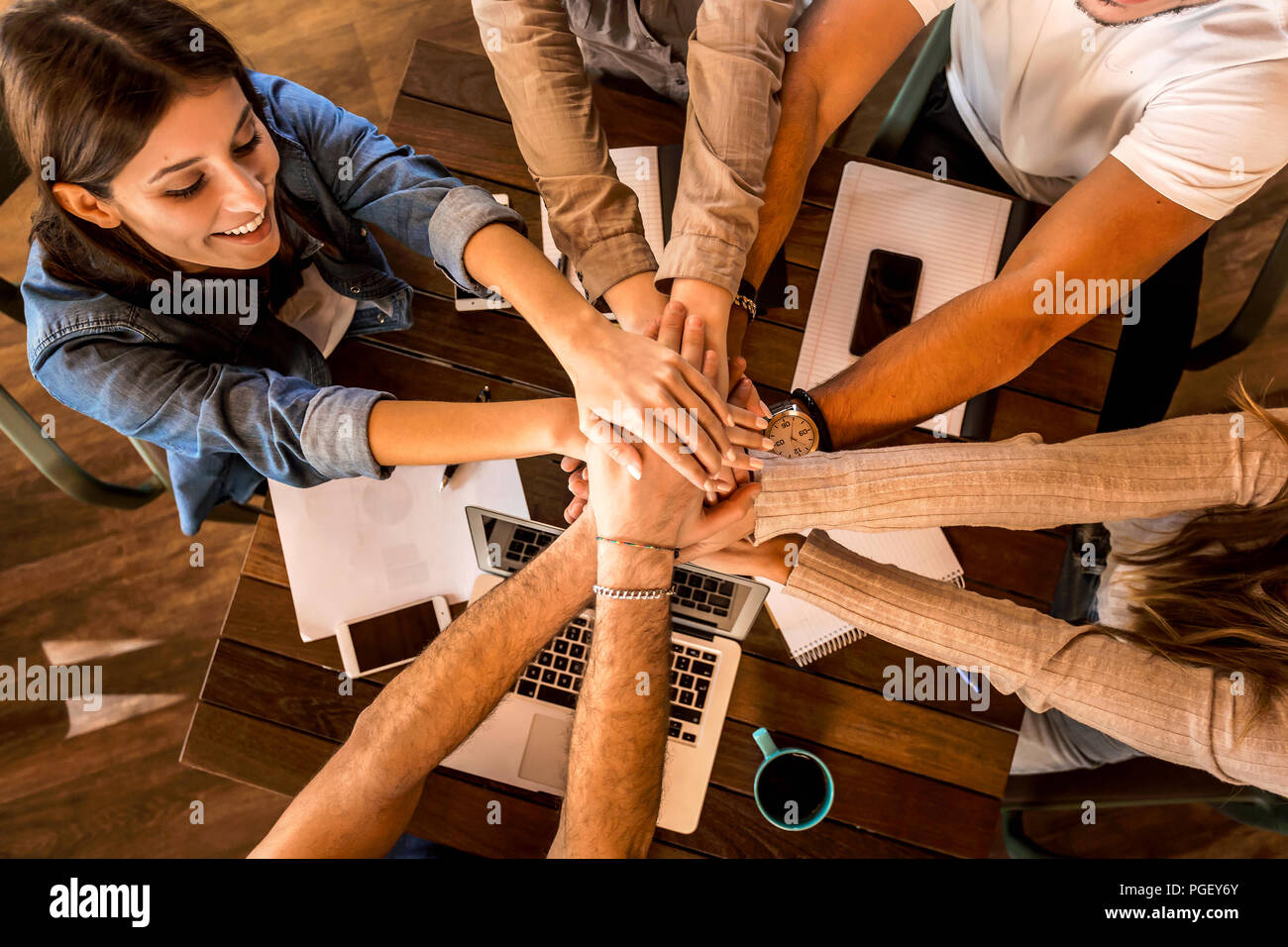 Friends hands together teamwork unity hi-res stock photography and ...