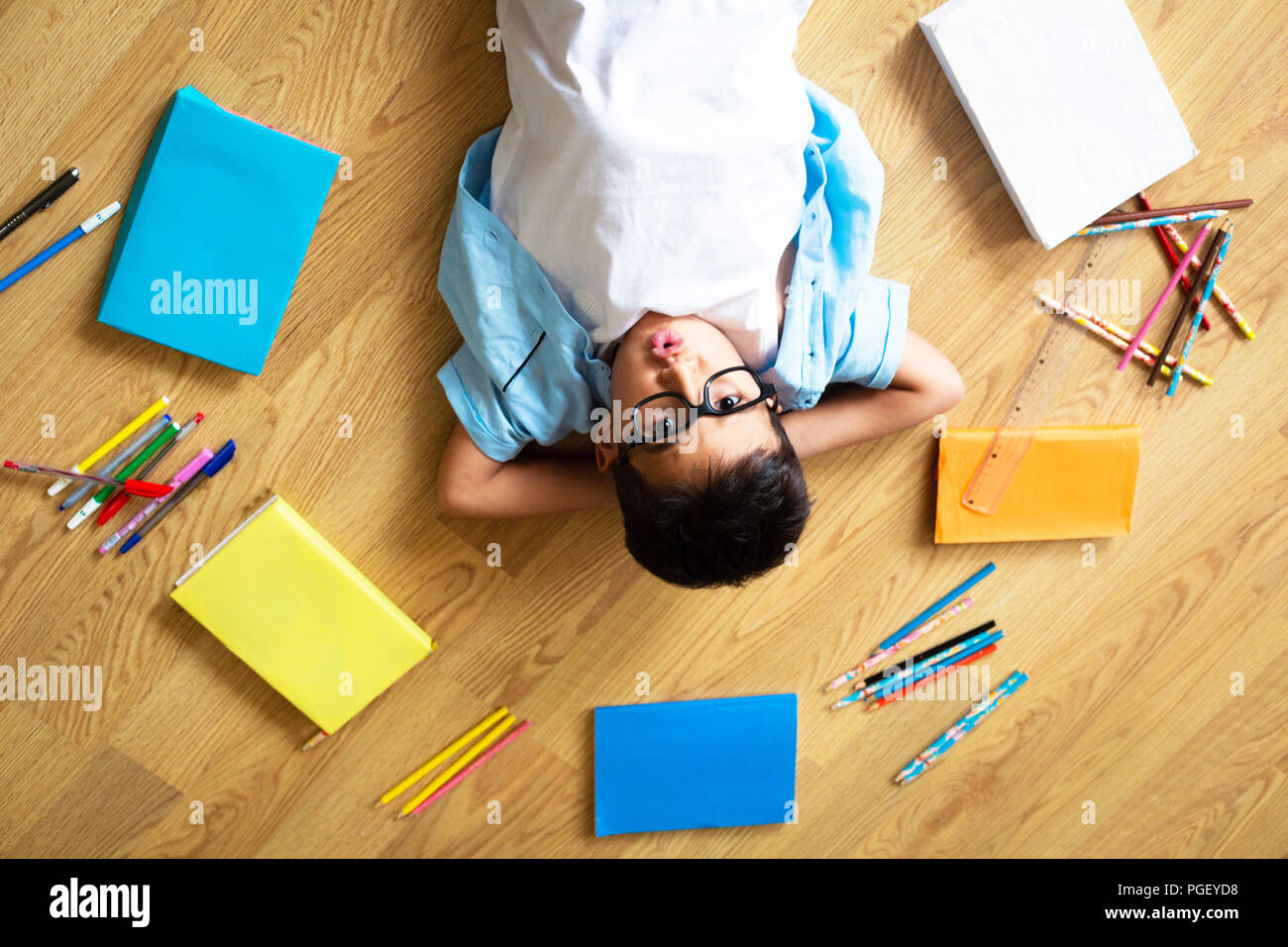 Happy smart school boy with books and stationary Stock Photo - Alamy