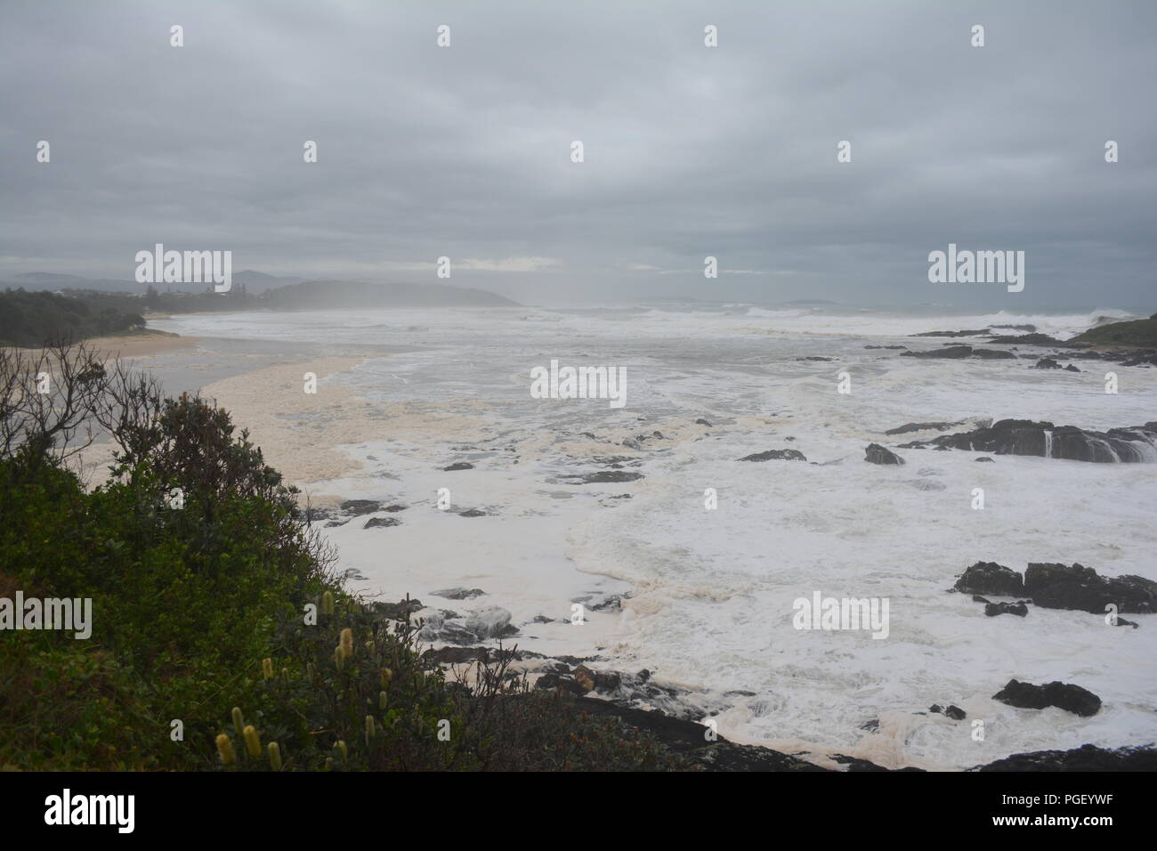 Stormy weather, sandy foamy frothy choppy ocean water from wild rough ...