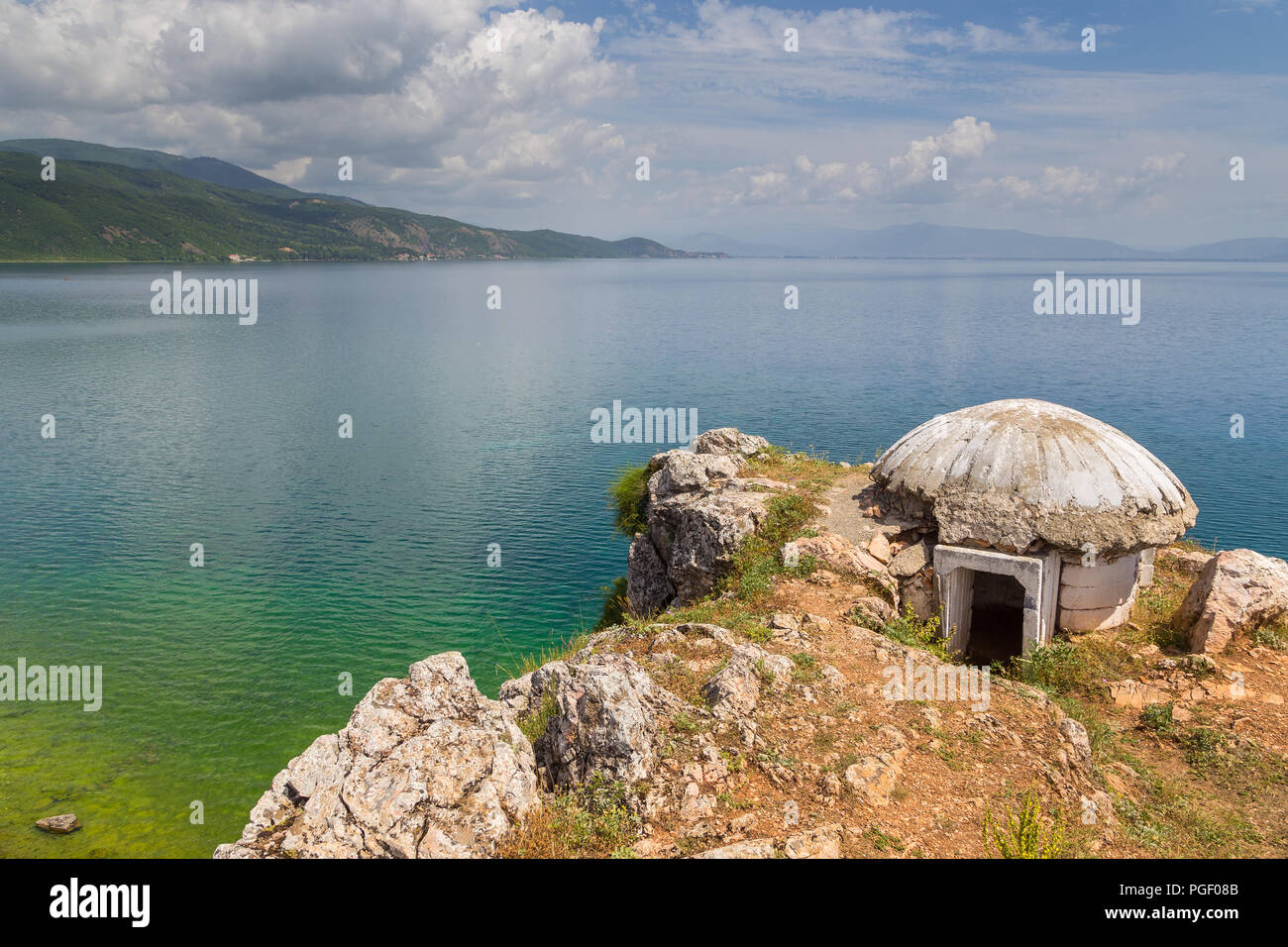 Old military bunker in Lin village. Ochrid lake in background. Albania ...