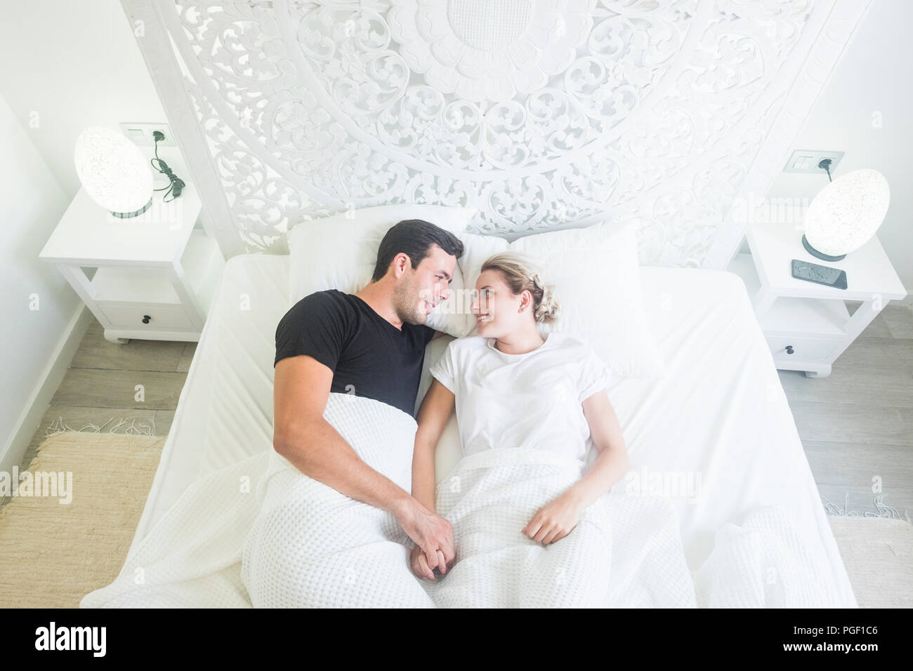 aerial view of beautiful caucasian young beautiful couple wake up at ...