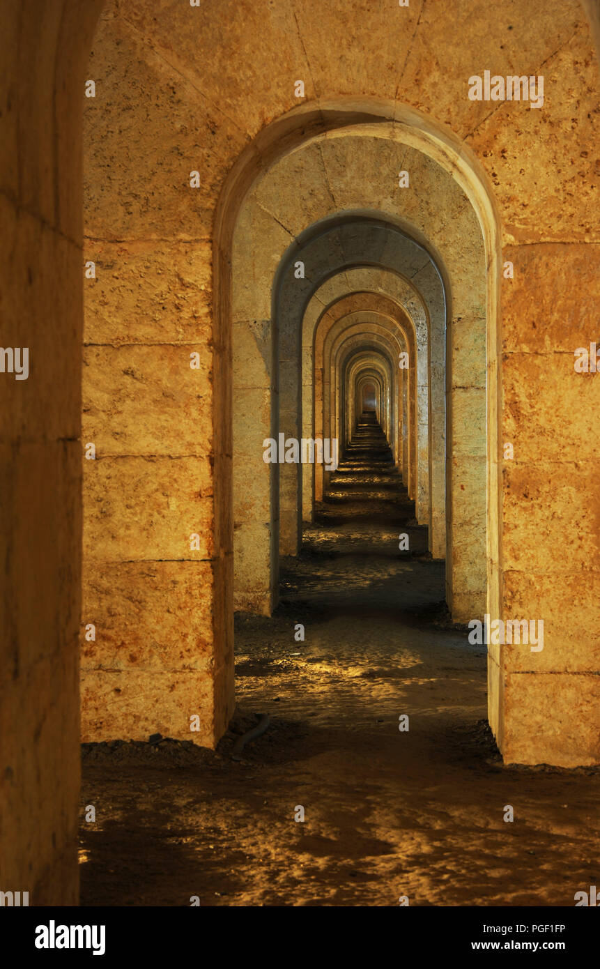 Passageway of arches known as the Keyhole Gallery, La Mola, Menorca ...