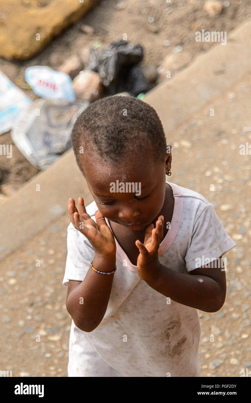 ACCRA, GHANA - JAN 8, 2017: Unidentified Ghanaian little girl in dirty ...