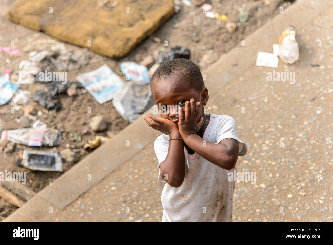 ACCRA, GHANA - JAN 8, 2017: Unidentified Ghanaian little girl in dirty ...