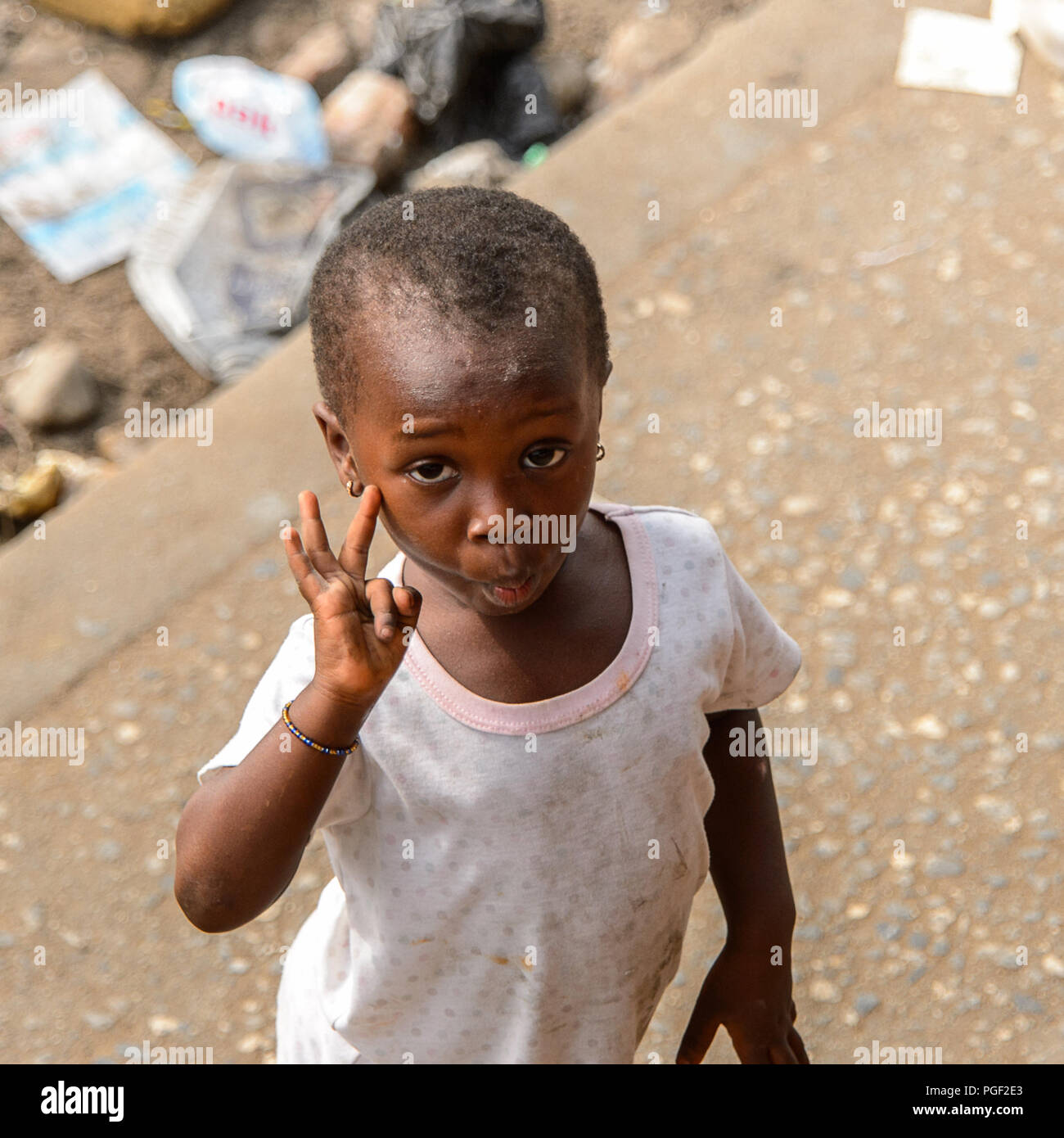 ACCRA, GHANA - JAN 8, 2017: Unidentified Ghanaian little girl in dirty ...