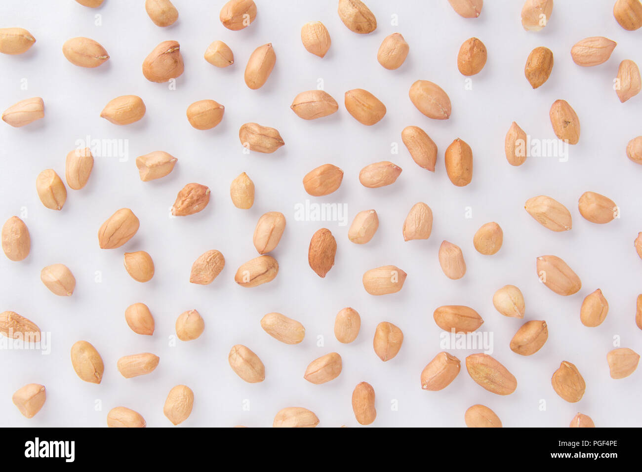 peanuts on gray color background. top view Stock Photo - Alamy