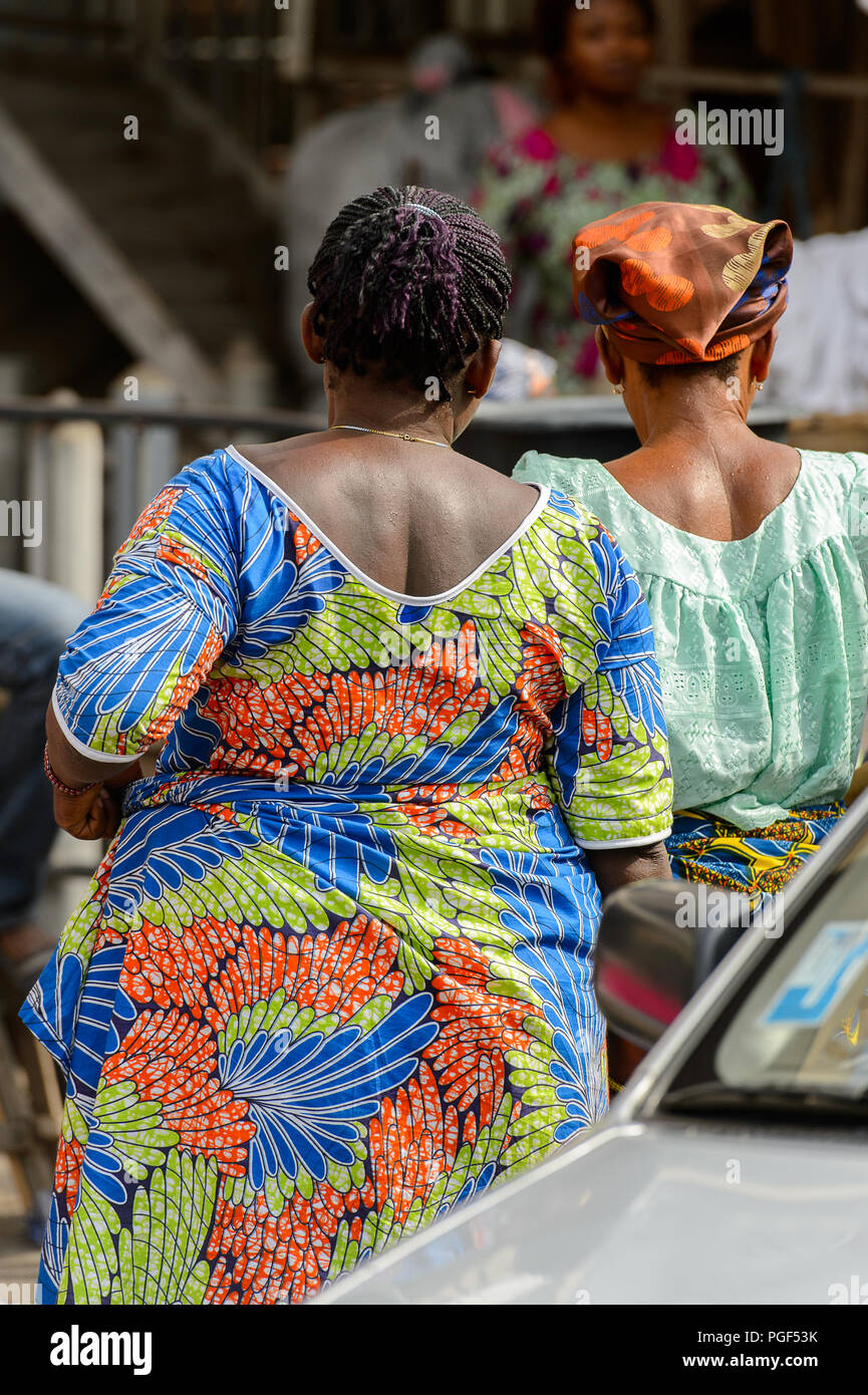 LOME, TOGO - Jan 9, 2017: Unidentified Togolese woman in colored dress ...