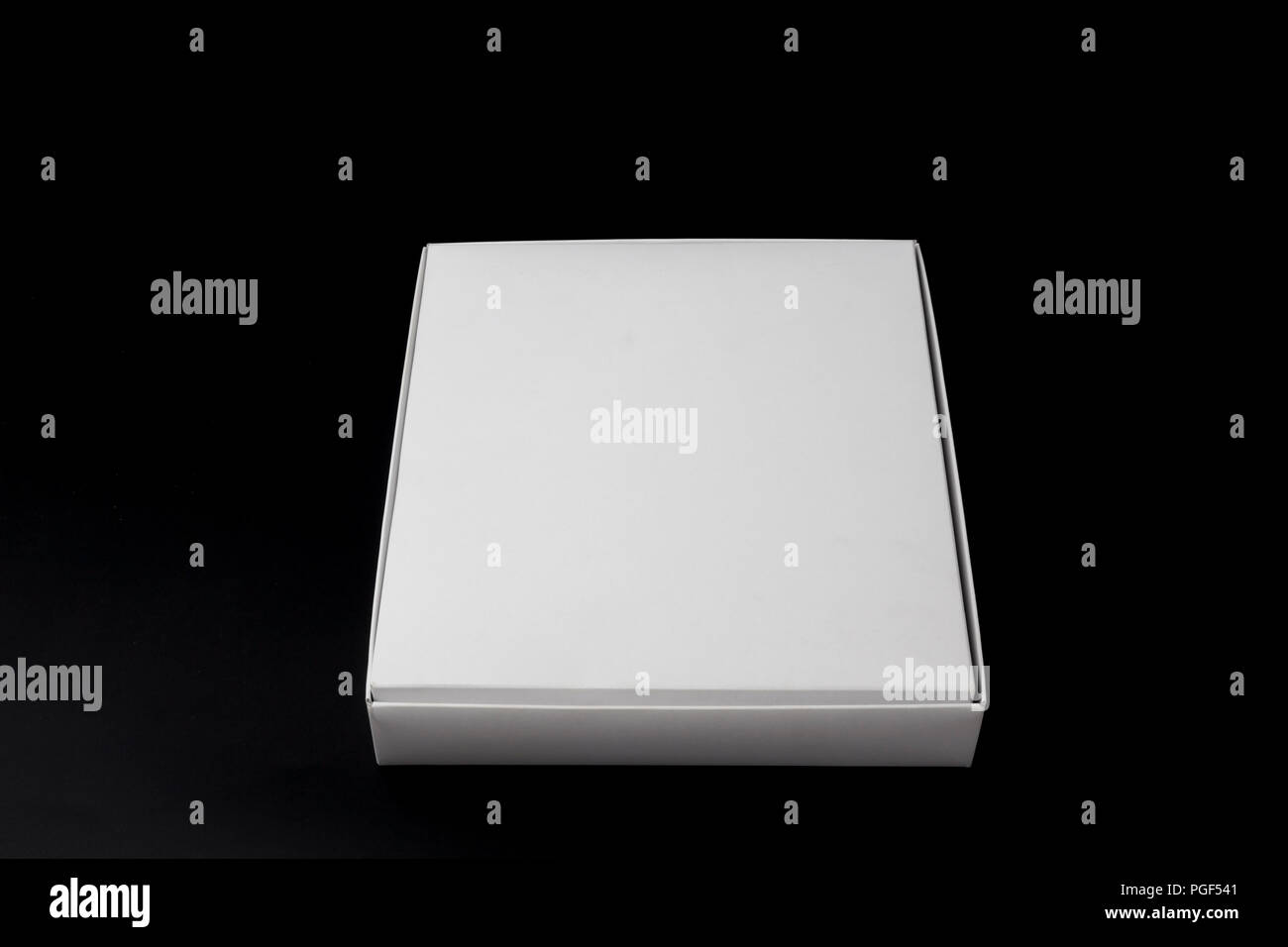 white box isolated on black background close up Stock Photo - Alamy