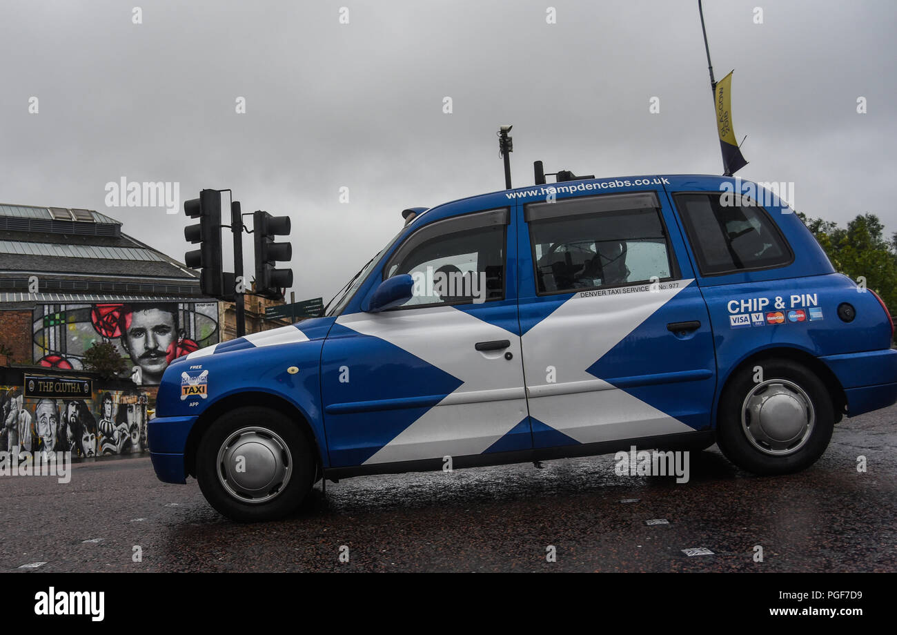 English taxi decorated with the Scottish flag through the streets of ...