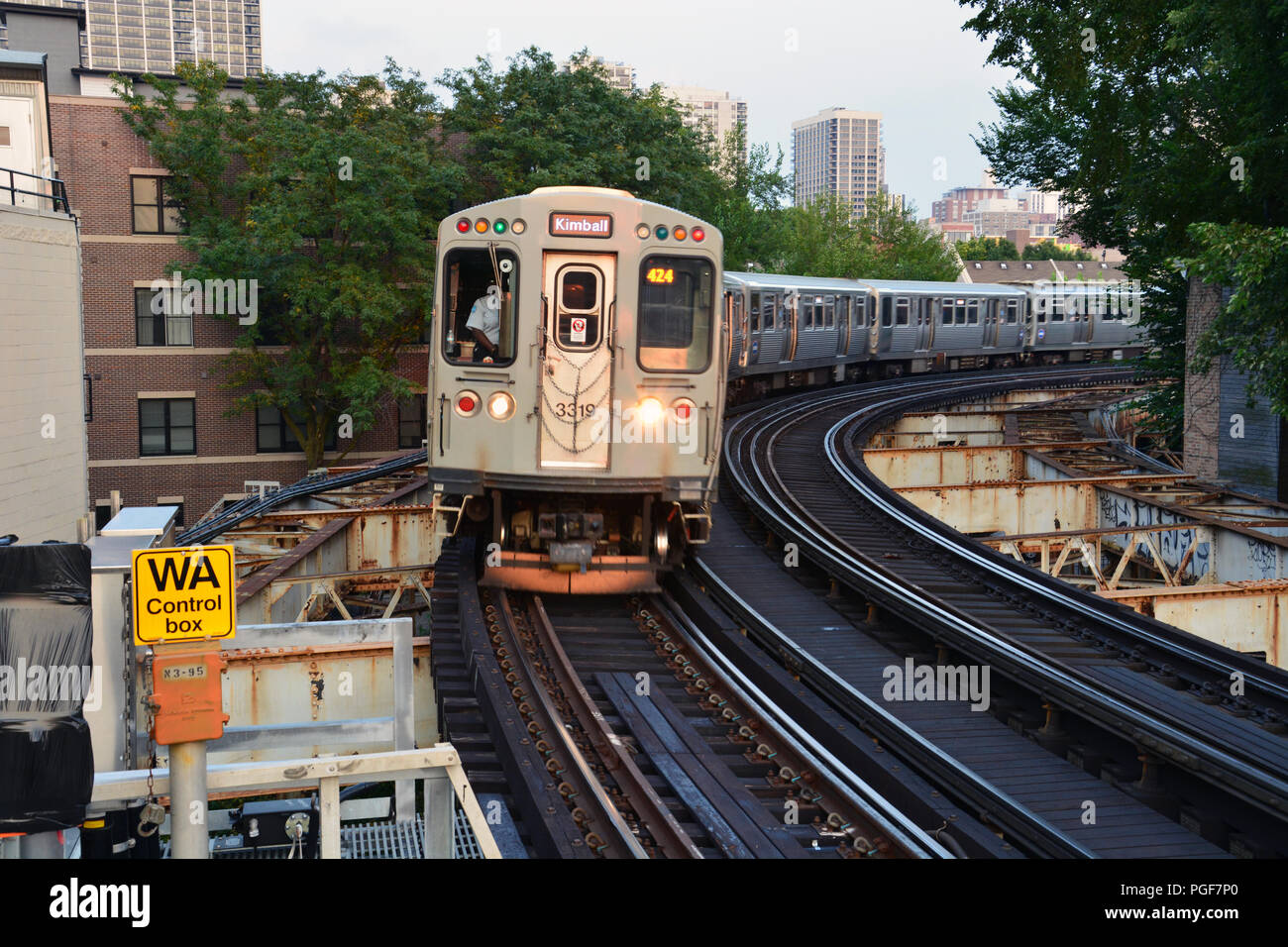 A Brown Line L Train rounds a corner and enters the Sedgewick station ...