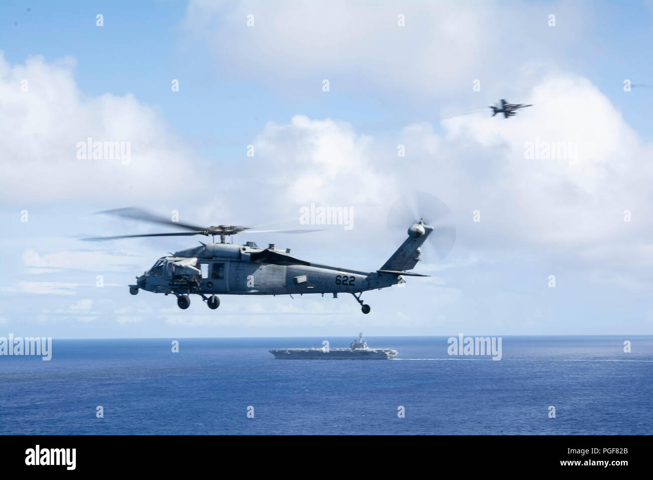180824-N-VI515-0243 WATERS SOUTH OF JAPAN (Aug. 24, 2018) An MH-60S Sea ...