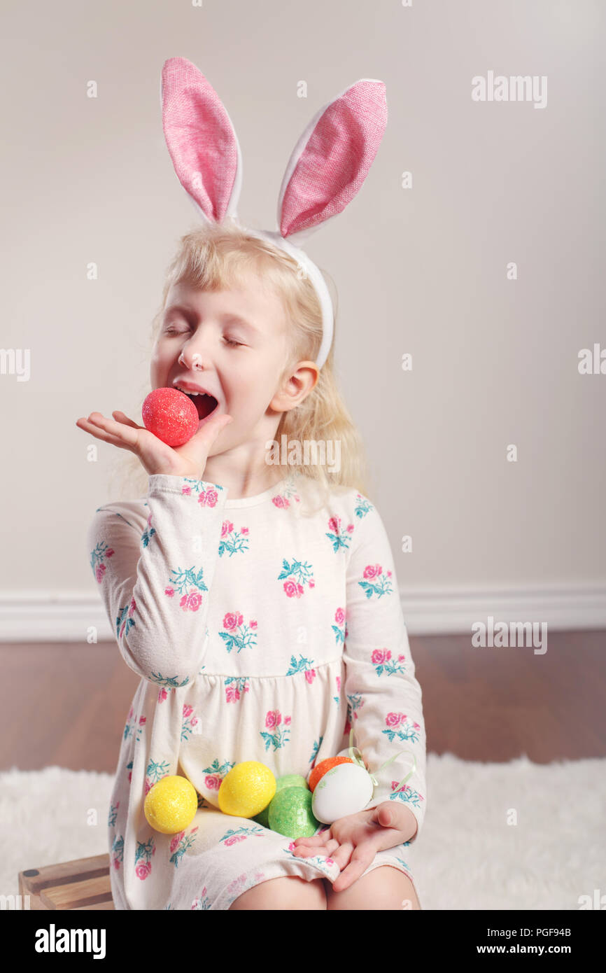 Cute adorable Caucasian child girl wearing Easter bunny rabbit ears in ...