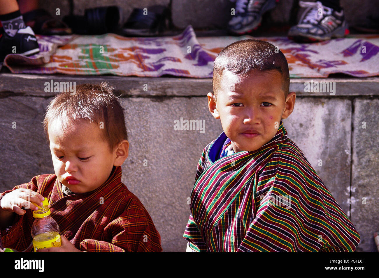 Two young boys in traditional costume known as a Gho. Photographed at ...