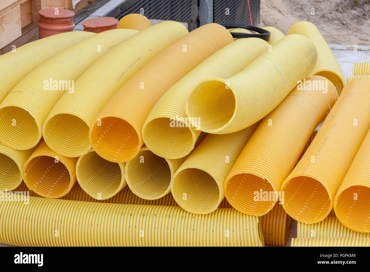 Yellow drain pipe - construction site Stock Photo - Alamy