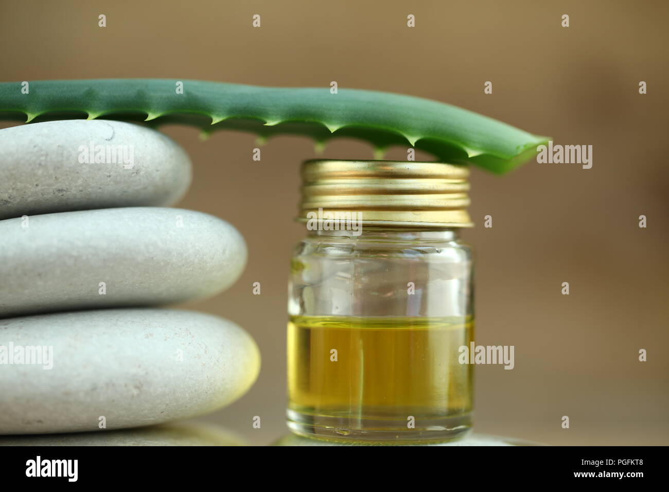 aloe oil spa therapy wood background Stock Photo - Alamy