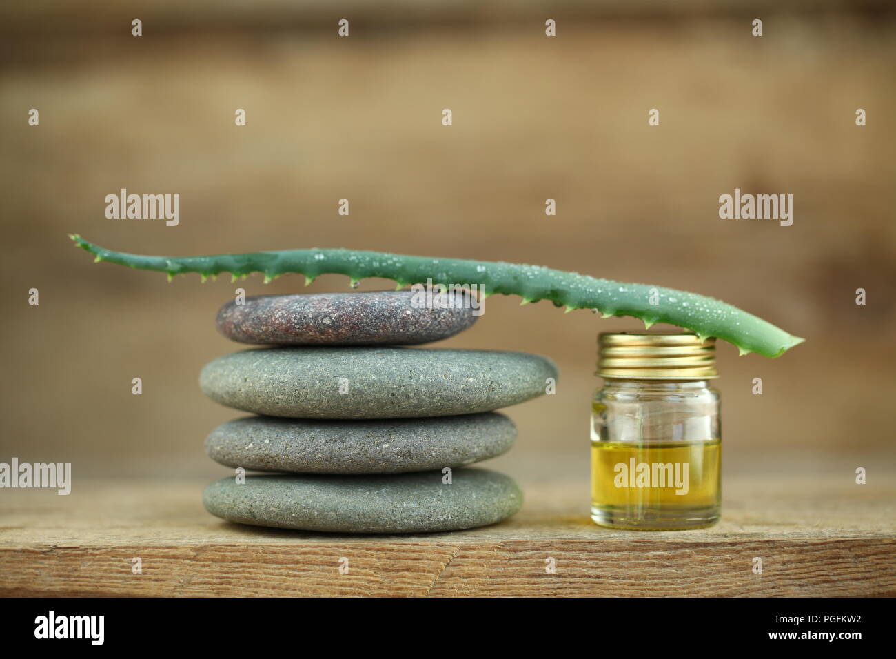aloe oil spa therapy wood background Stock Photo - Alamy