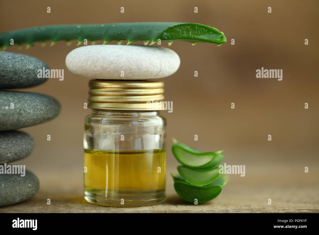 aloe oil spa therapy wood background Stock Photo - Alamy