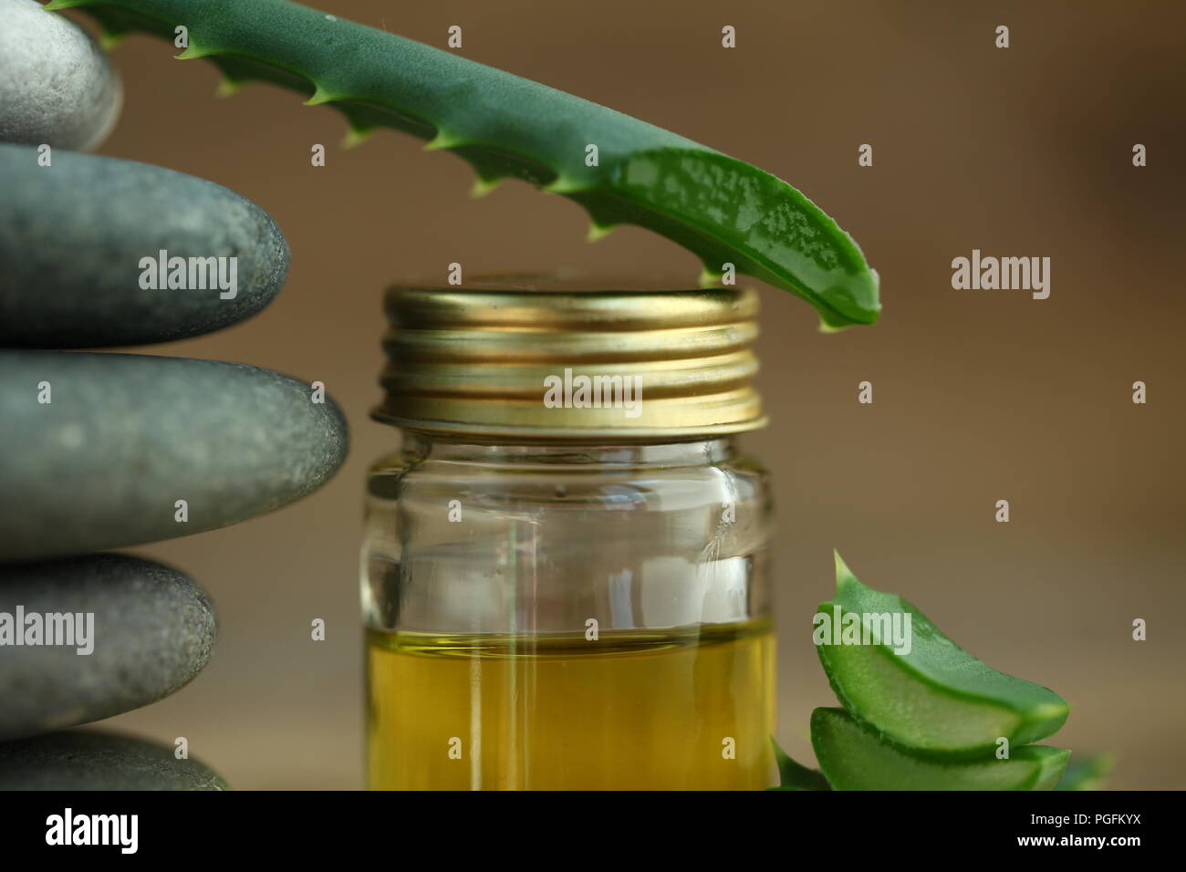 aloe oil spa therapy wood background Stock Photo - Alamy