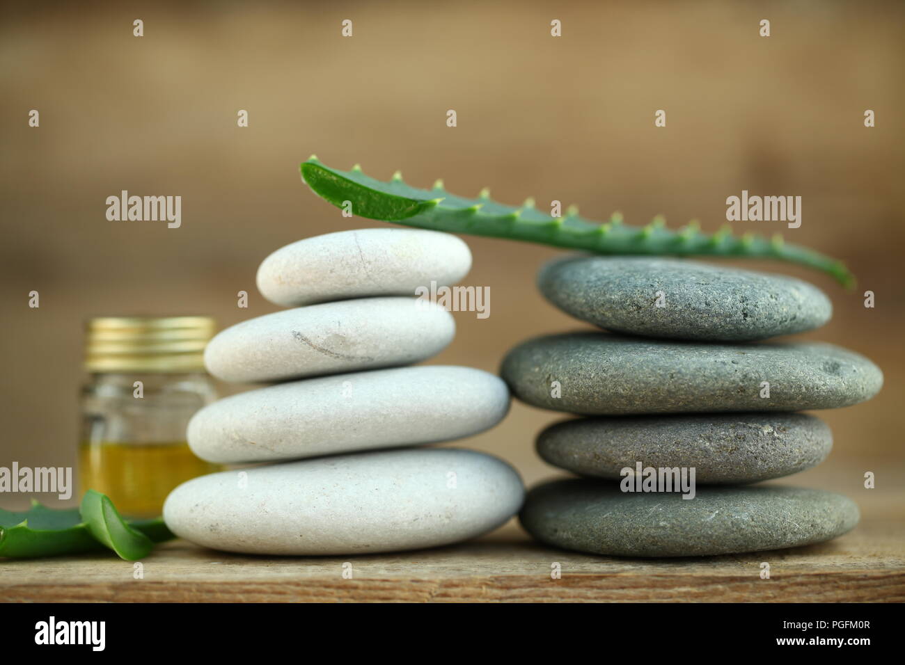 aloe oil spa therapy wood background Stock Photo - Alamy