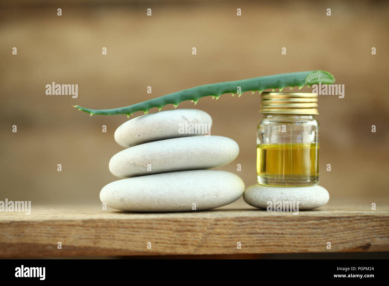 aloe oil spa therapy wood background Stock Photo - Alamy