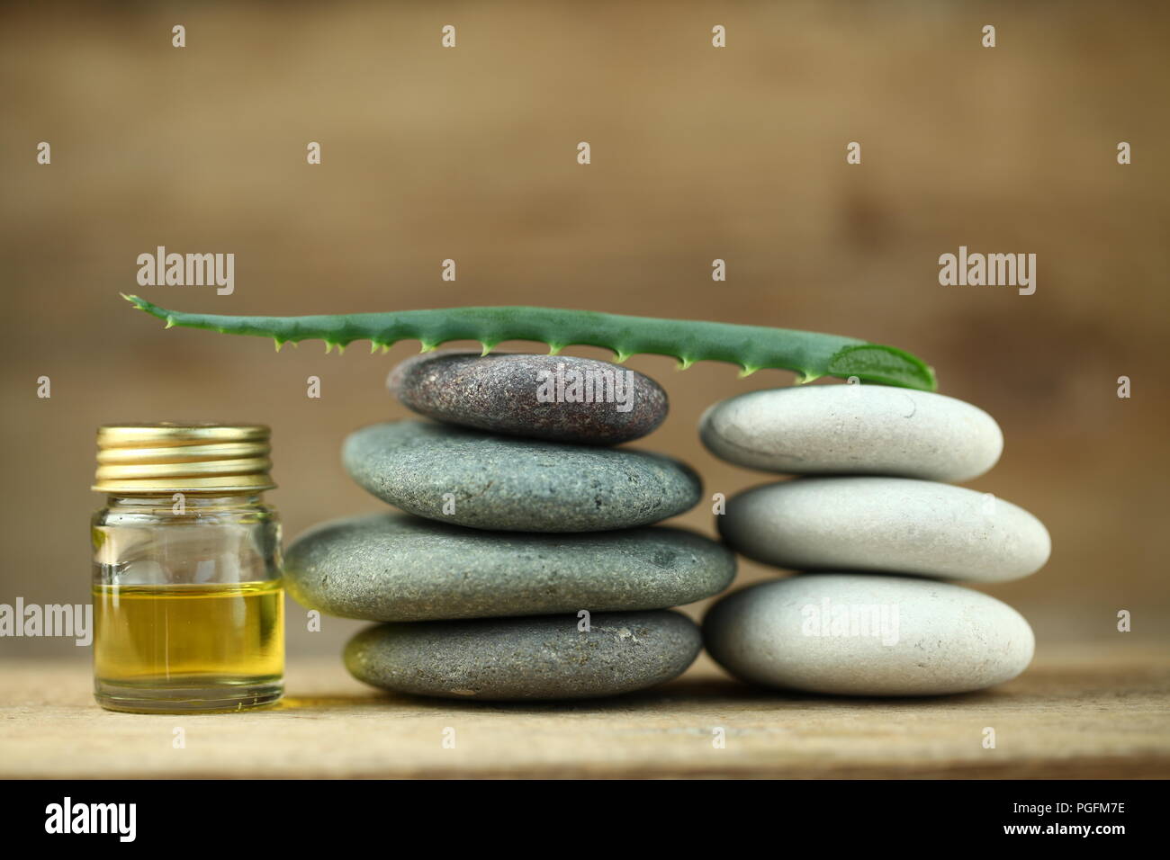 aloe oil spa therapy wood background Stock Photo - Alamy