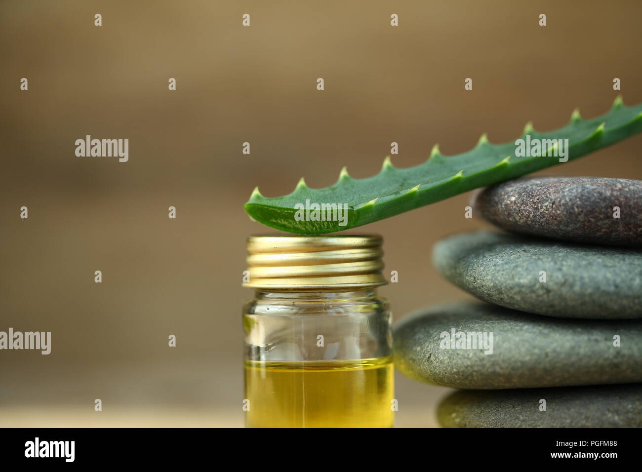 aloe oil spa therapy wood background Stock Photo - Alamy