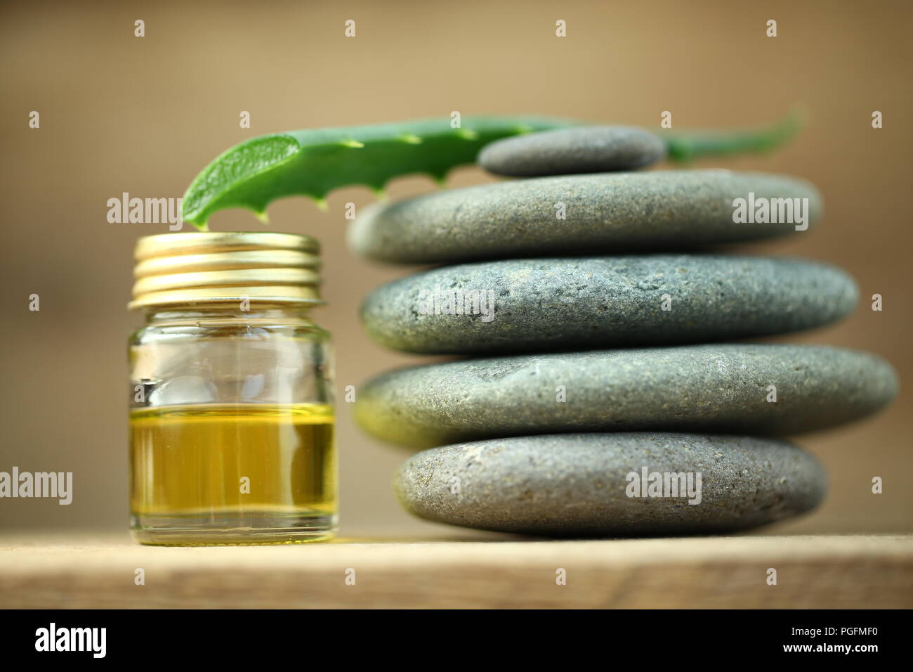 aloe oil spa therapy wood background Stock Photo - Alamy