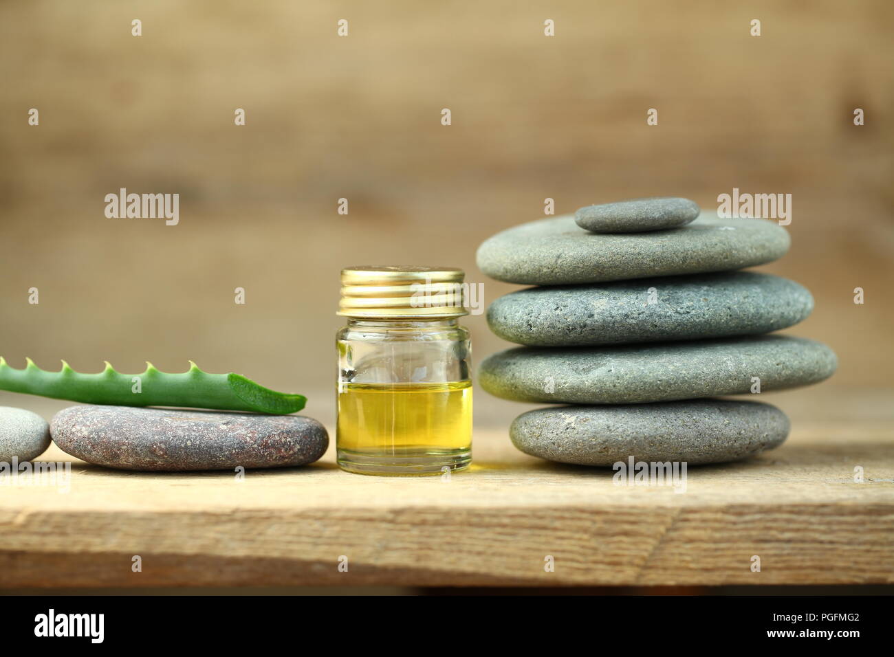 aloe oil spa therapy wood background Stock Photo - Alamy