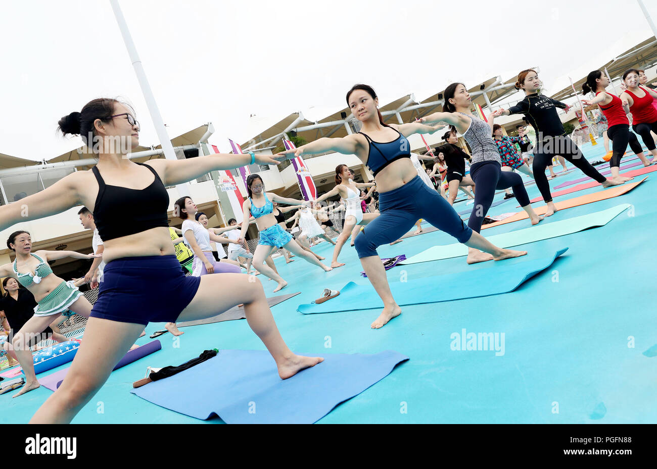 Shanghai, China. 26th Aug, 2018. People practise yoga at a park in ...