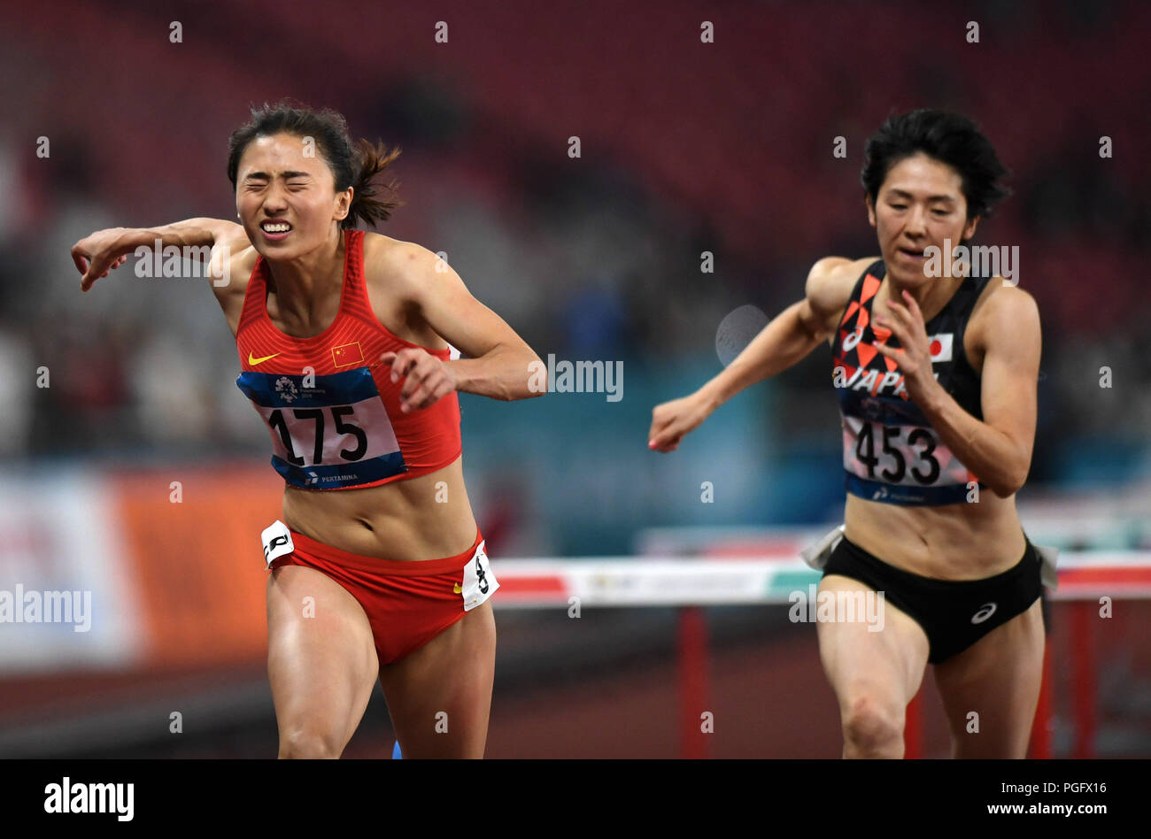 Jakarta. 26th Aug, 2018. Wang Dou (L) of China competes during the ...