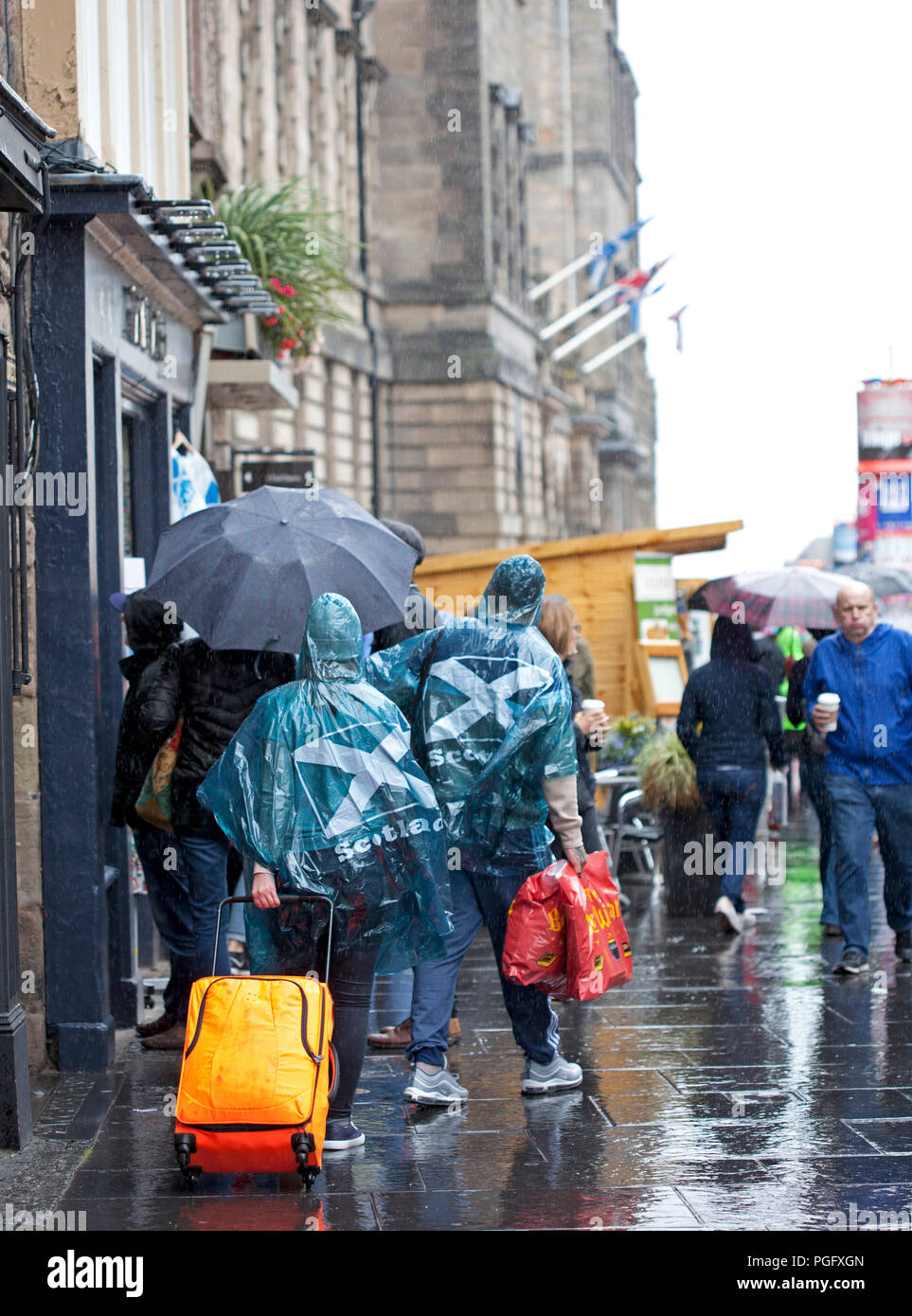 Rain capes hi-res stock photography and images - Alamy