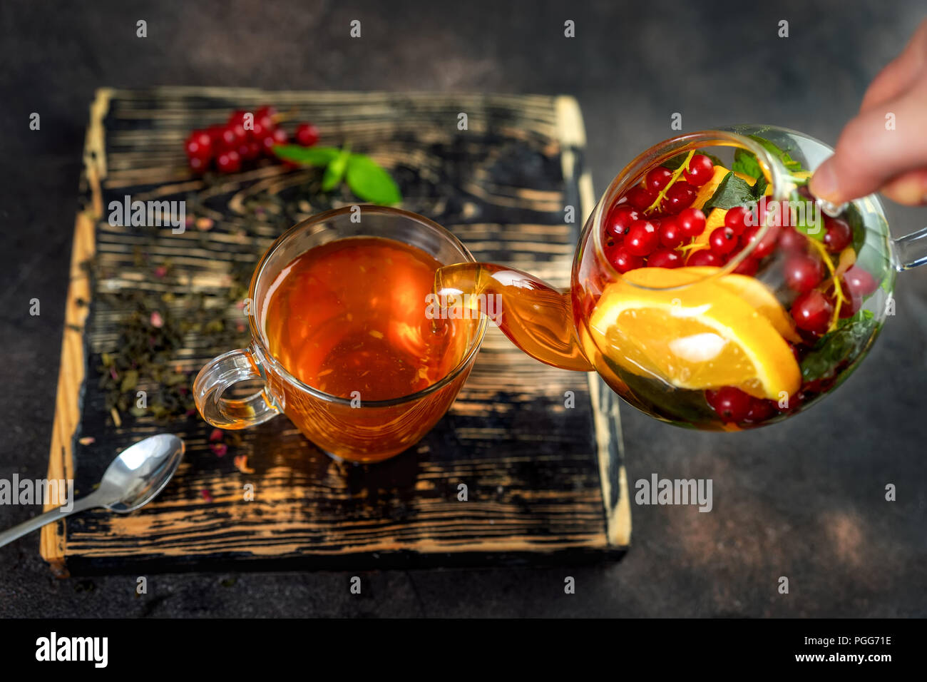 Pouring hot tea in cup hi-res stock photography and images - Alamy