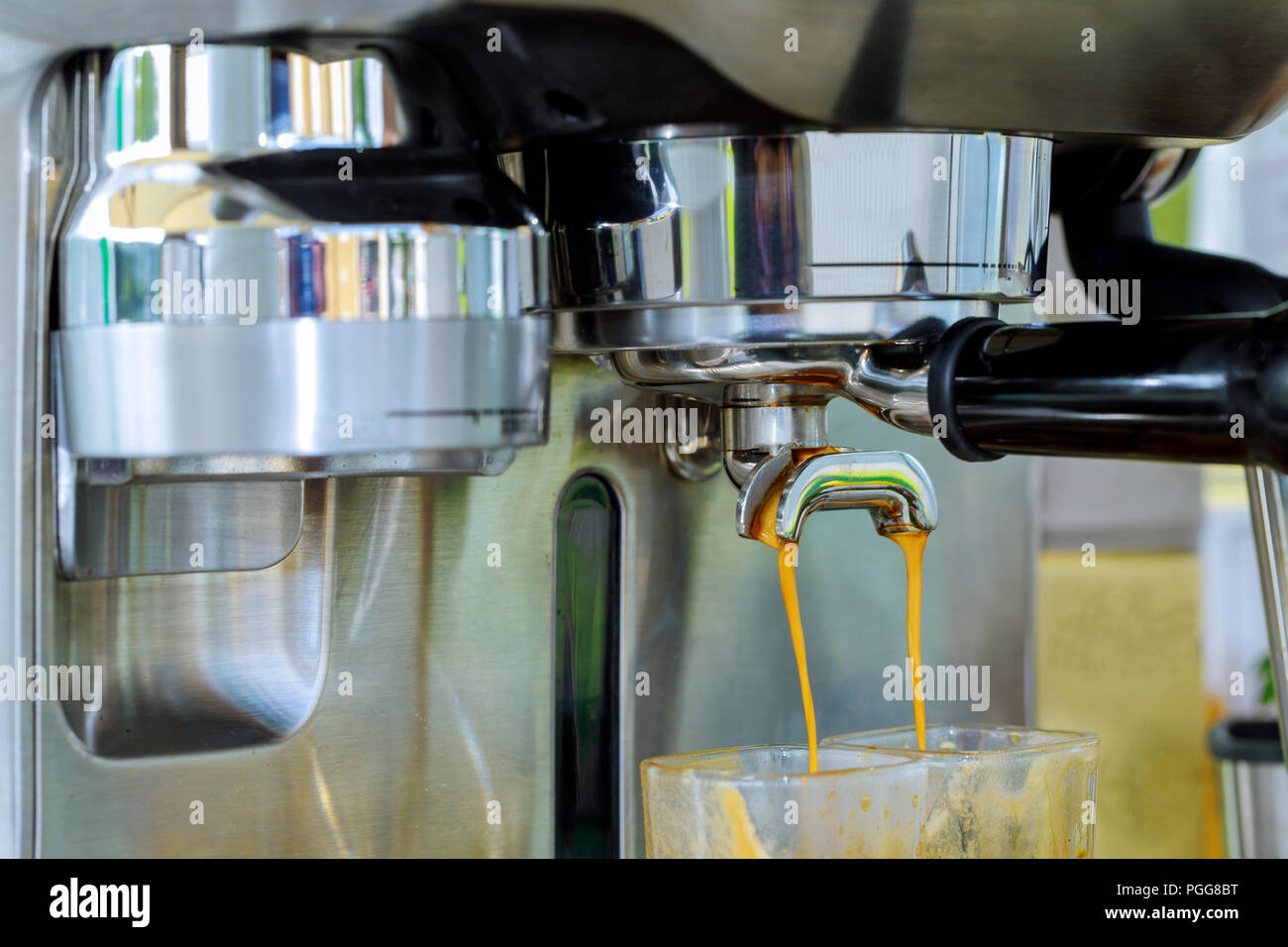 Process of preparation of coffee, a closeup. Espresso machine on a bar ...