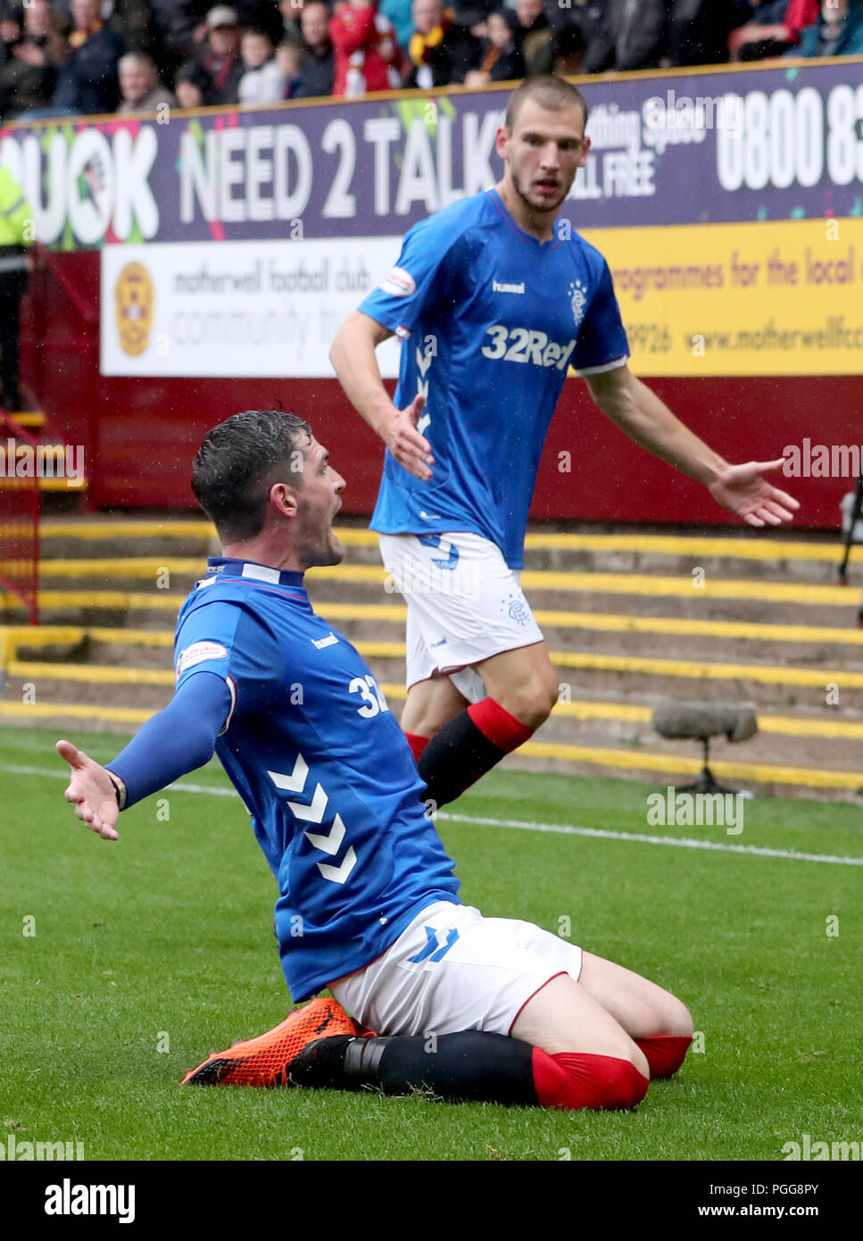 Rangers kyle lafferty celebrates with his team mates hi-res stock ...