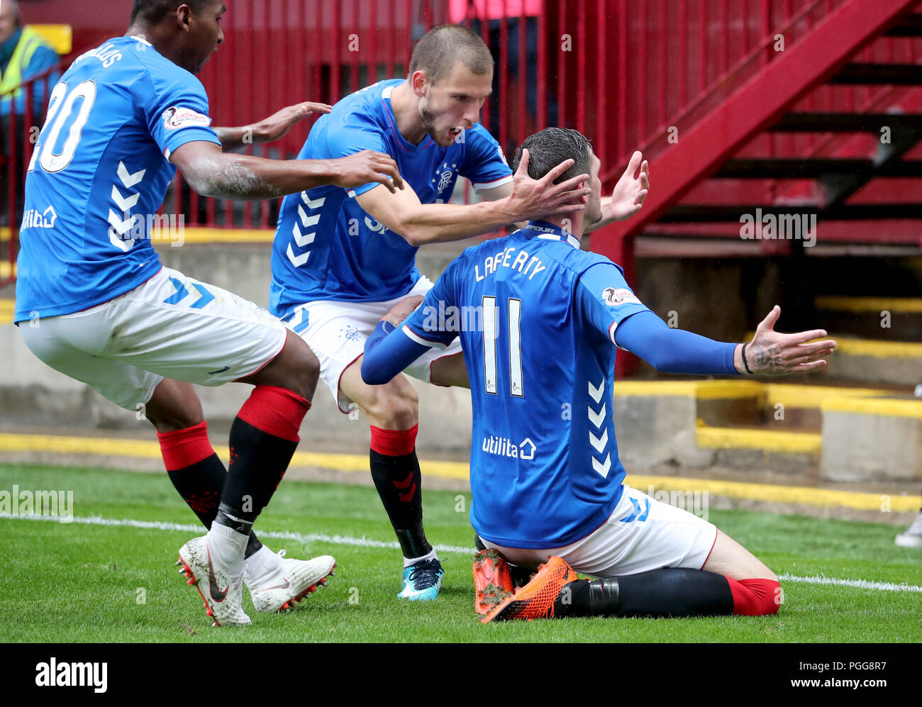Rangers kyle lafferty celebrates with his team mates hi-res stock ...