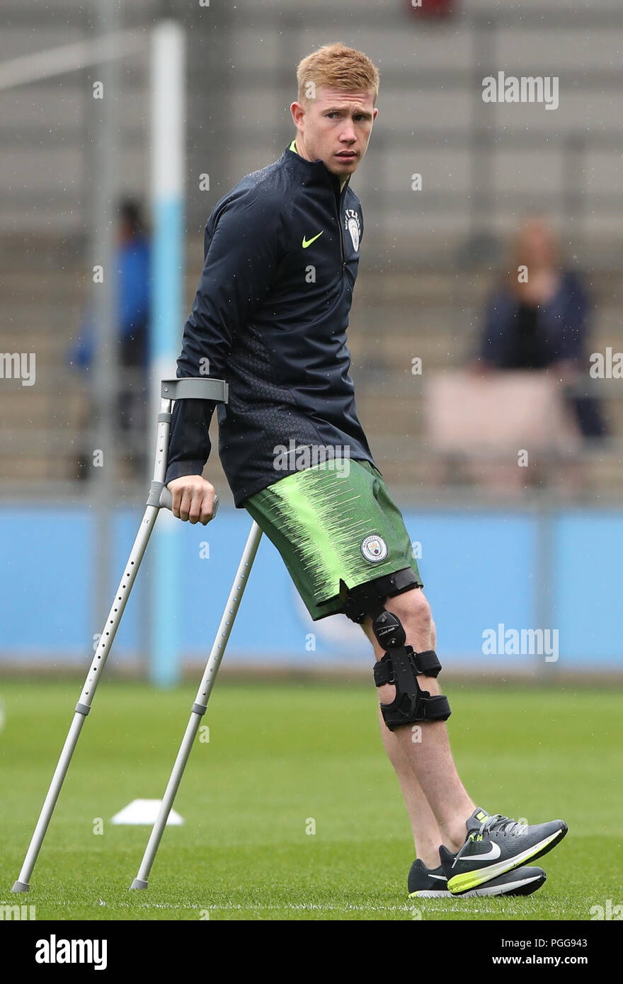 Manchester citys kevin de bruyne on crutches hi-res stock photography ...
