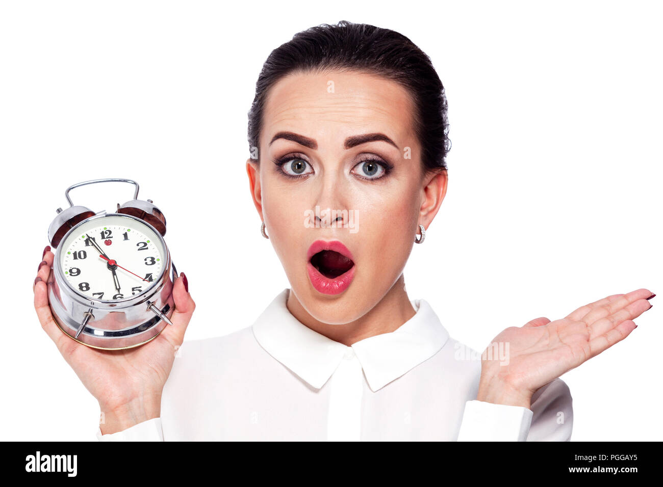 Closeup portrait of shocked woman with an alarm clock isolated on white ...